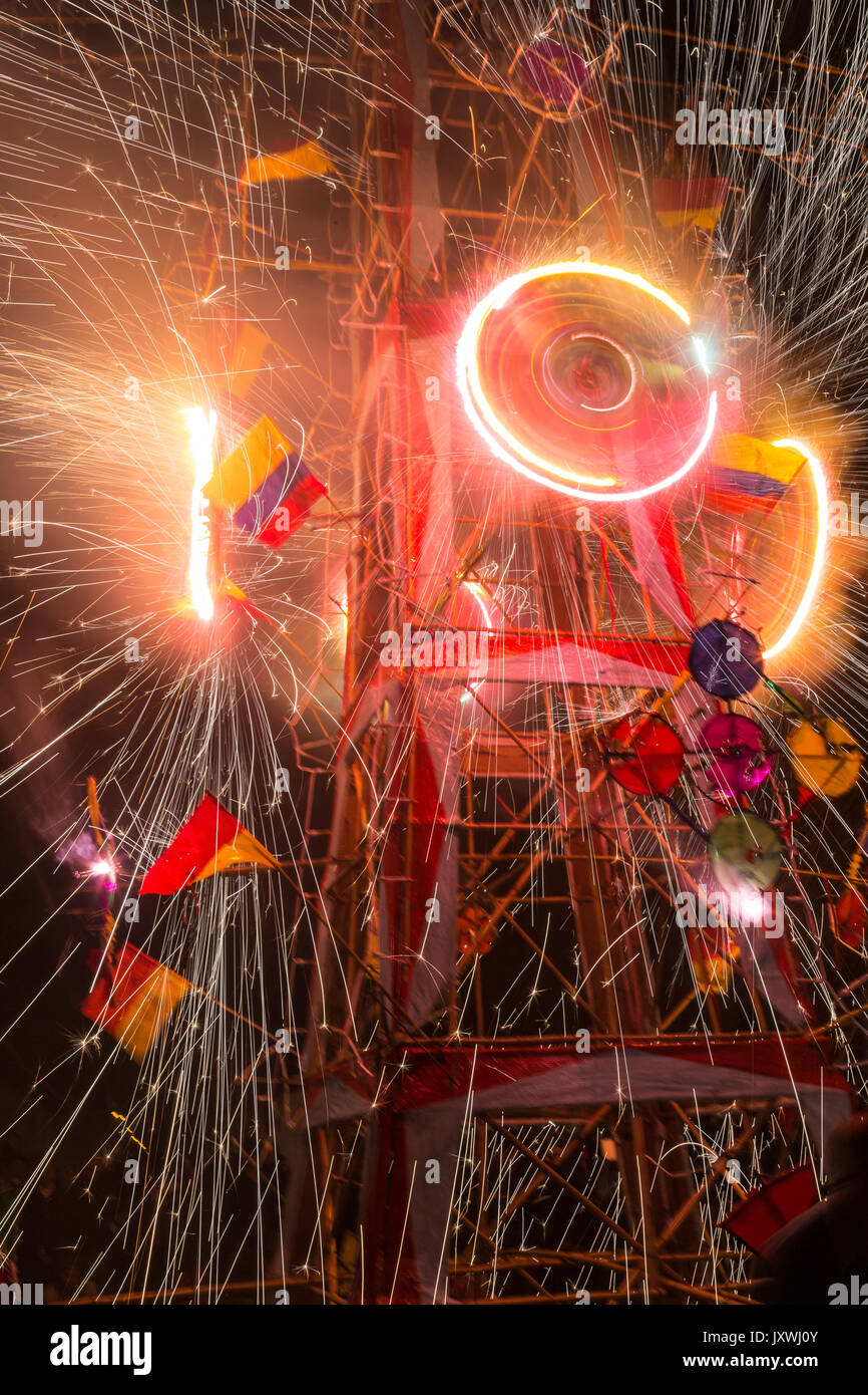 Bamboo towers are filled with various fireworks, and then lit within a ...