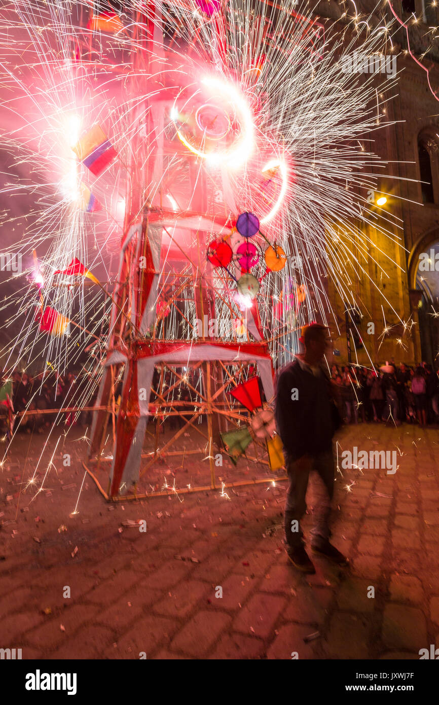 Bamboo towers are filled with various fireworks, and then lit within a ...