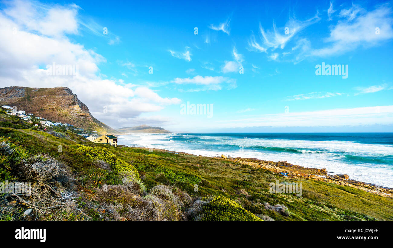 The long beach and misty cliffs on the west coast of the Cape Peninsula ...