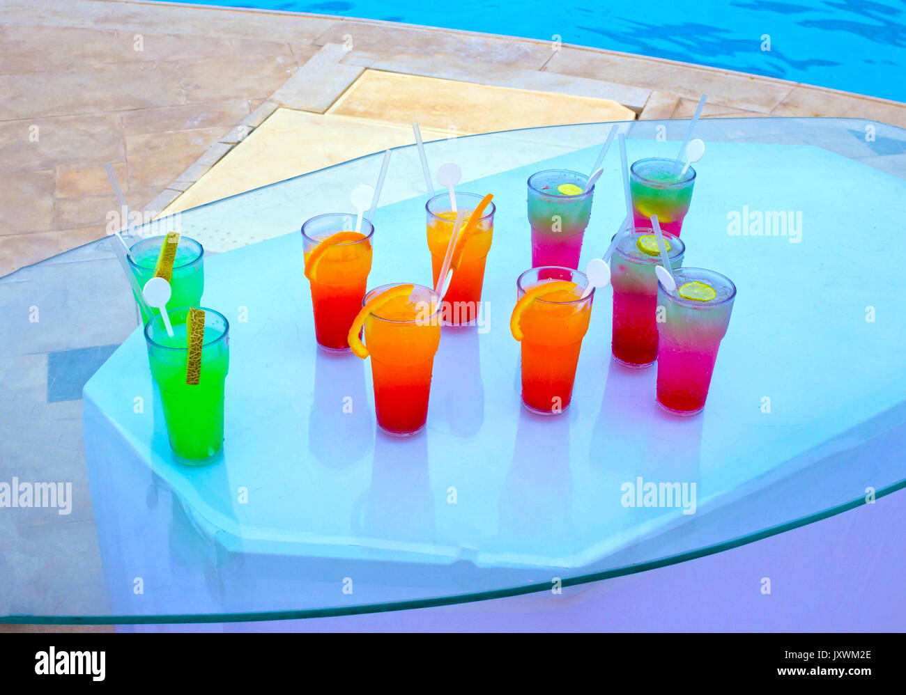 Fruit cocktail glasses at pool Stock Photo - Alamy
