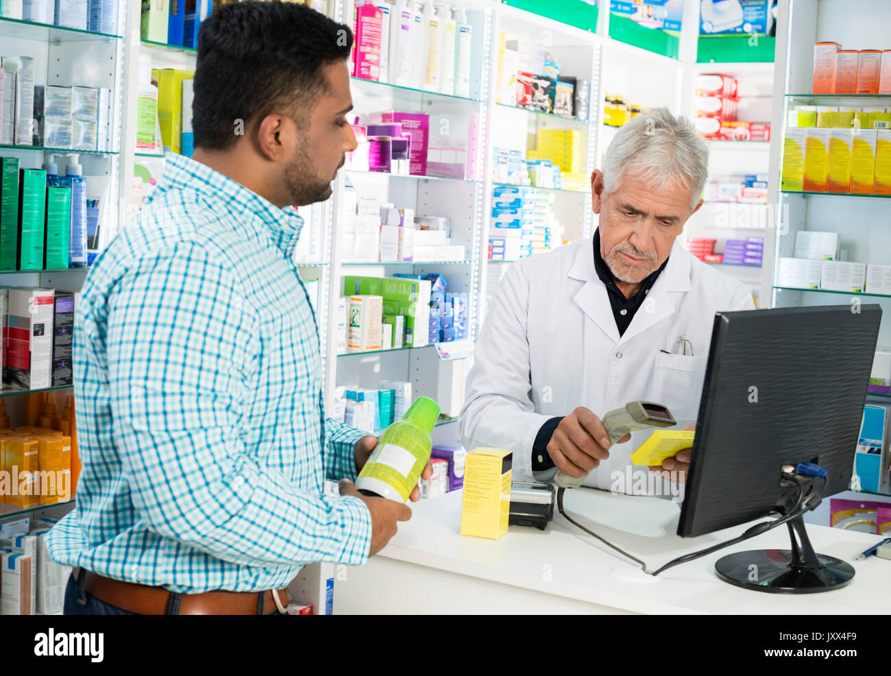 Young male customer scanning hi-res stock photography and images - Alamy