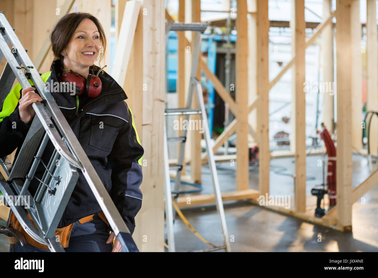 Construction worker carrying ladder hi-res stock photography and images ...