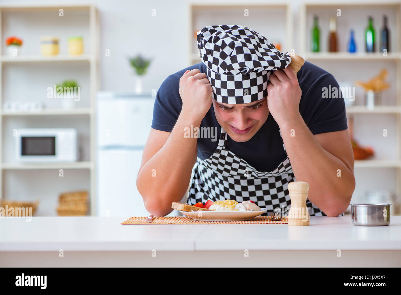 Chef cook cooking a meal breakfast dinner in the kitchen Stock Photo ...