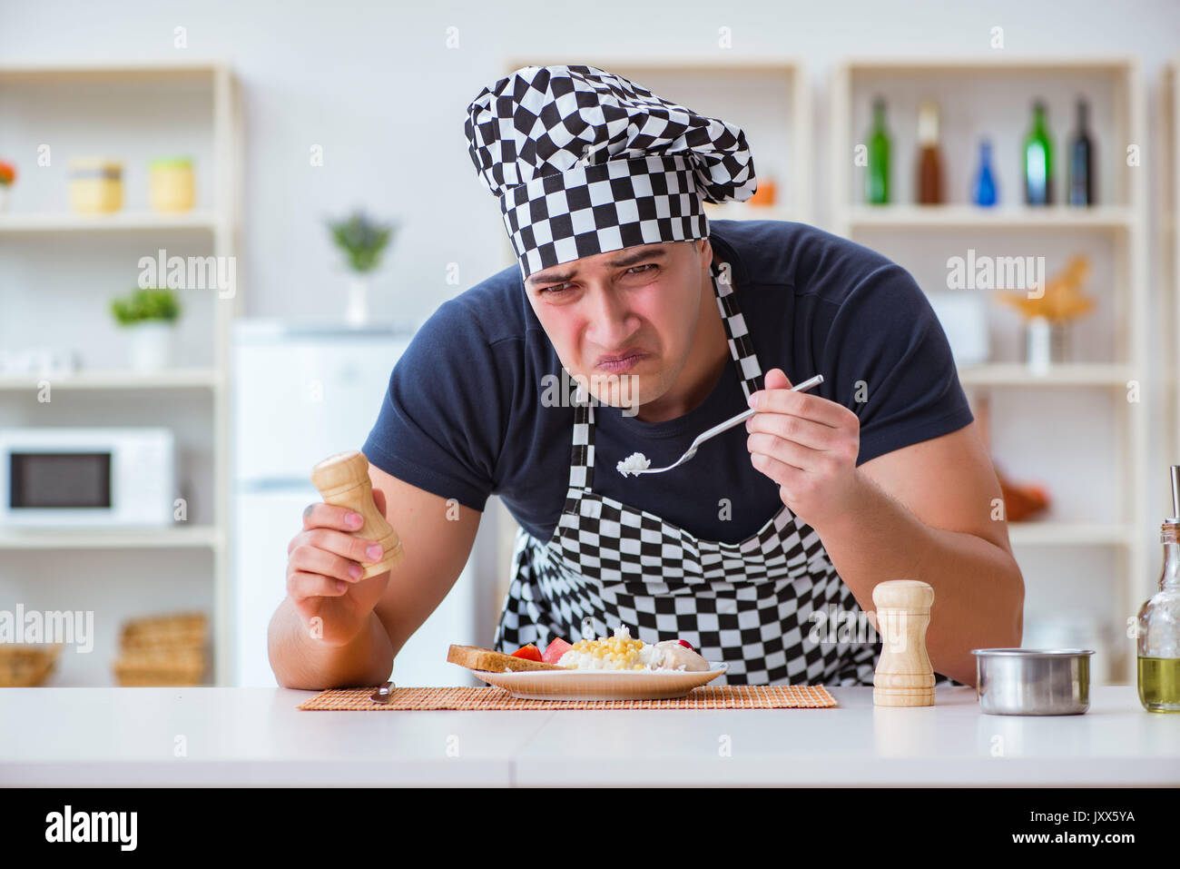 Chef cook cooking a meal breakfast dinner in the kitchen Stock Photo ...
