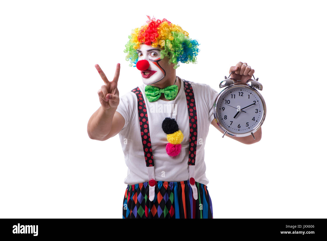 Funny clown with an alarm clock isolated on white background Stock ...