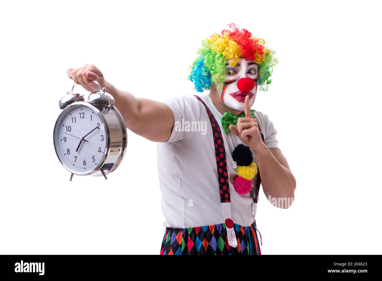Funny clown with an alarm clock isolated on white background Stock ...