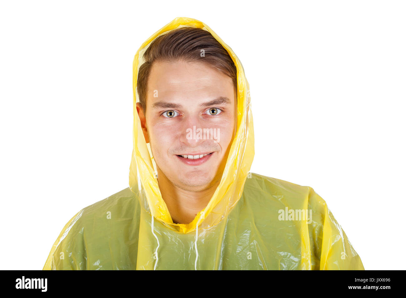 Picture of a caucasian young man wearing a yellow raincoat, posing on ...