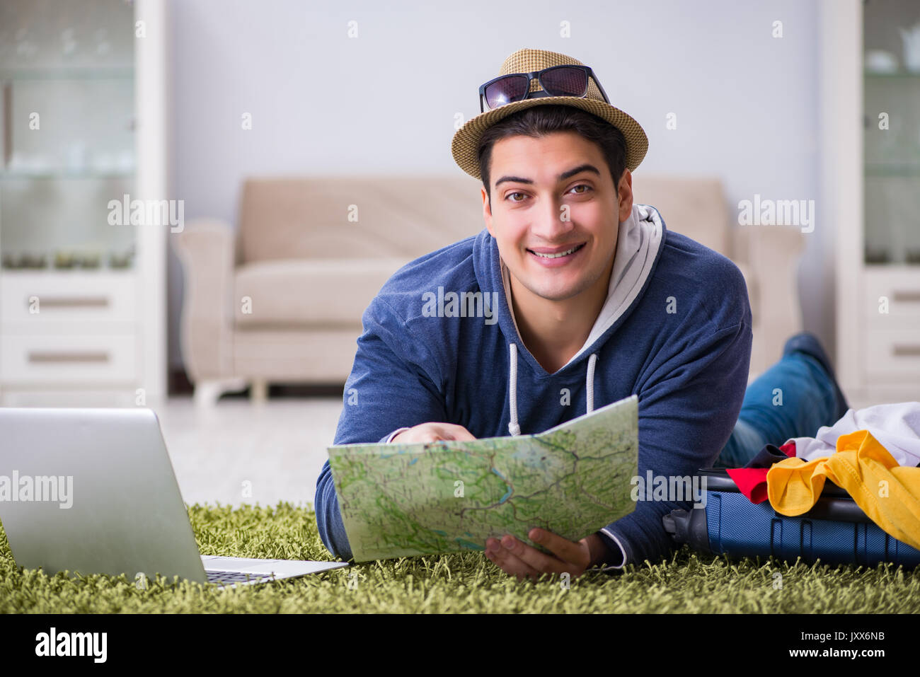Man planning his vacation trip with map Stock Photo - Alamy