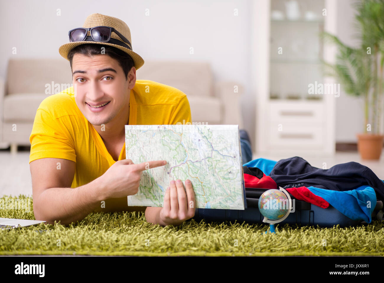 Man planning his vacation trip with map Stock Photo - Alamy