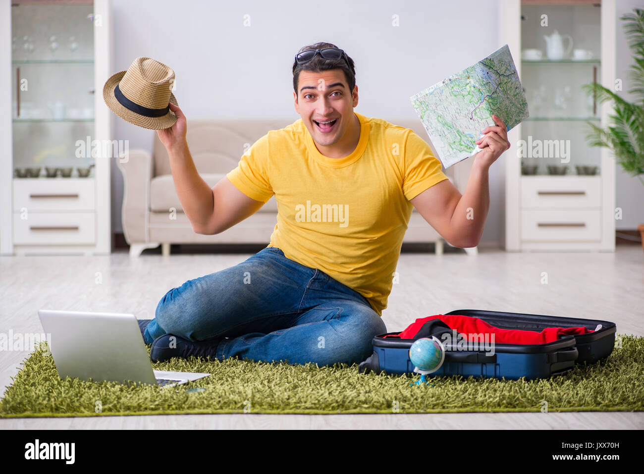 Man planning his vacation trip with map Stock Photo - Alamy