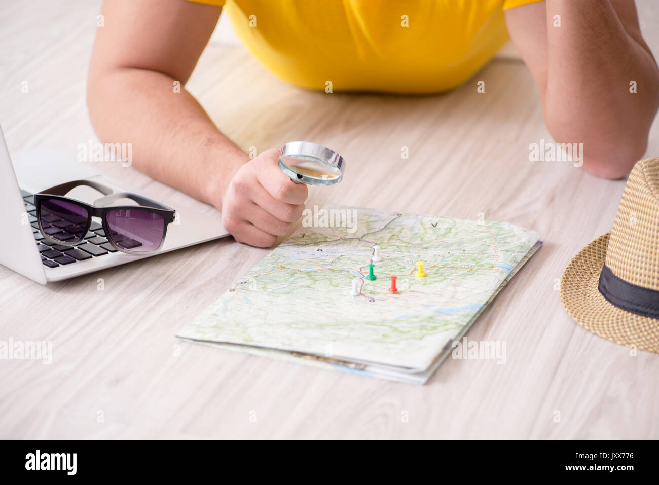 Man planning his vacation trip with map Stock Photo - Alamy