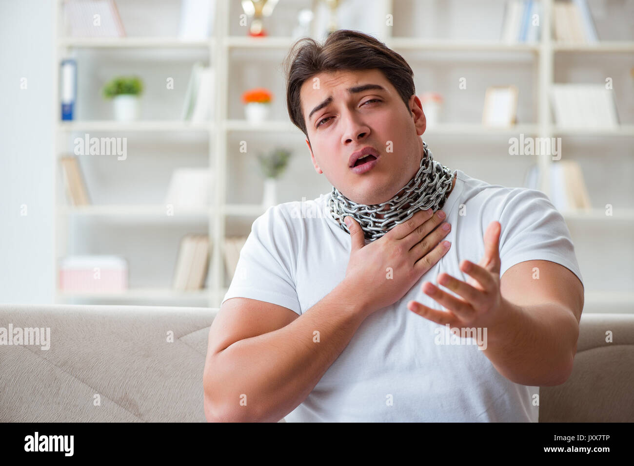 Young man suffering from sore throat Stock Photo - Alamy