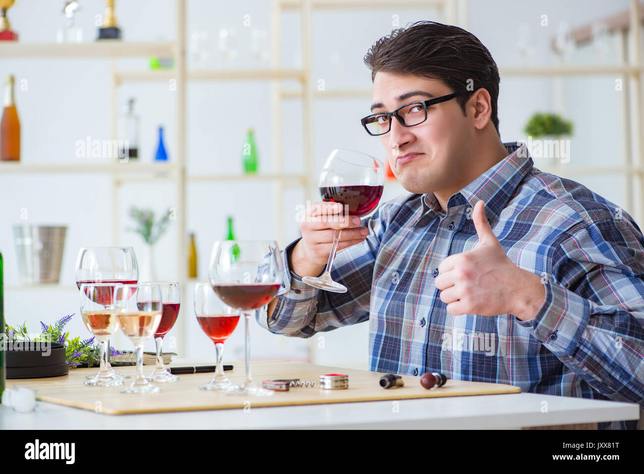 Professional sommelier tasting red wine Stock Photo - Alamy