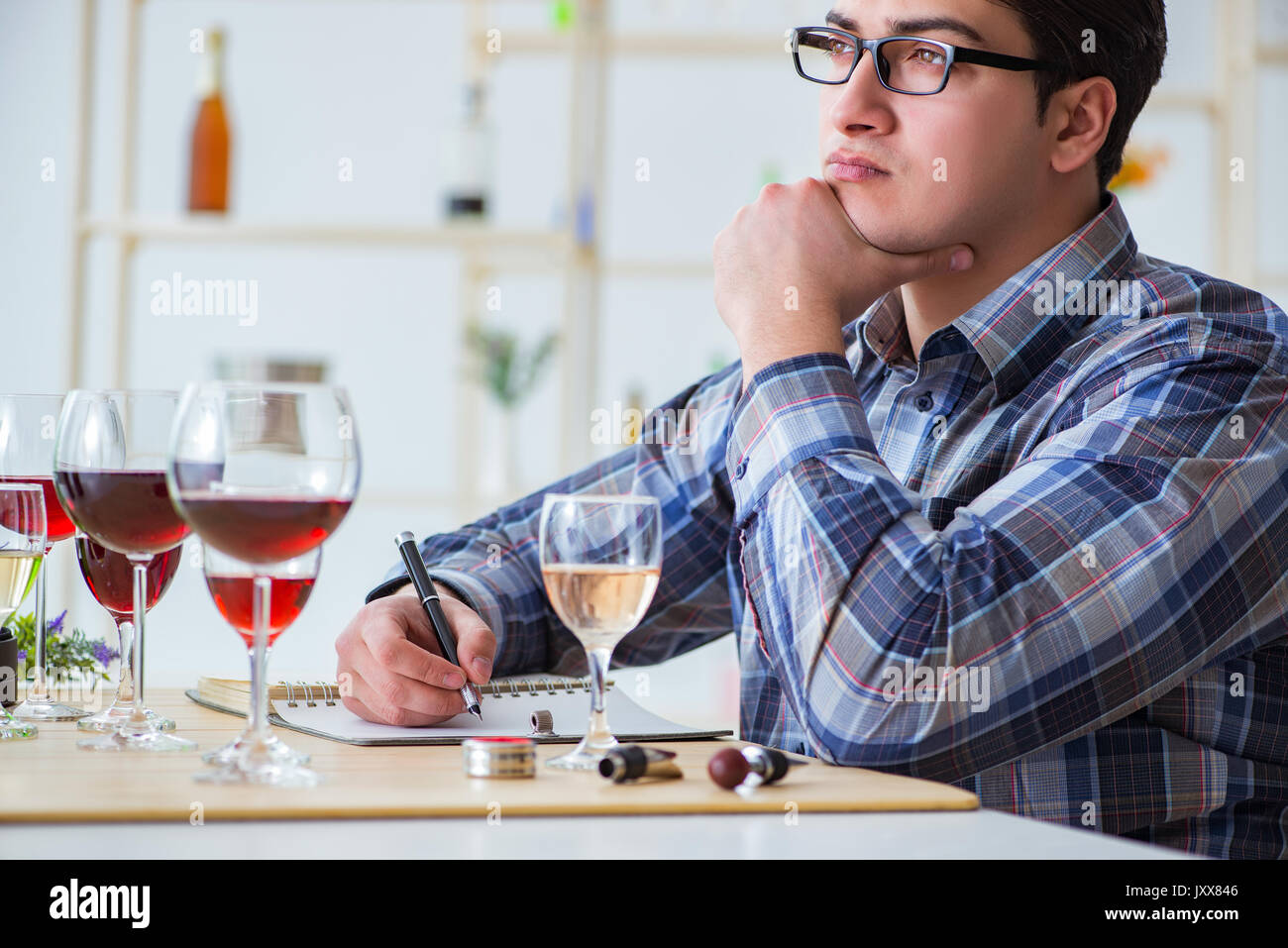 Professional sommelier tasting red wine Stock Photo - Alamy