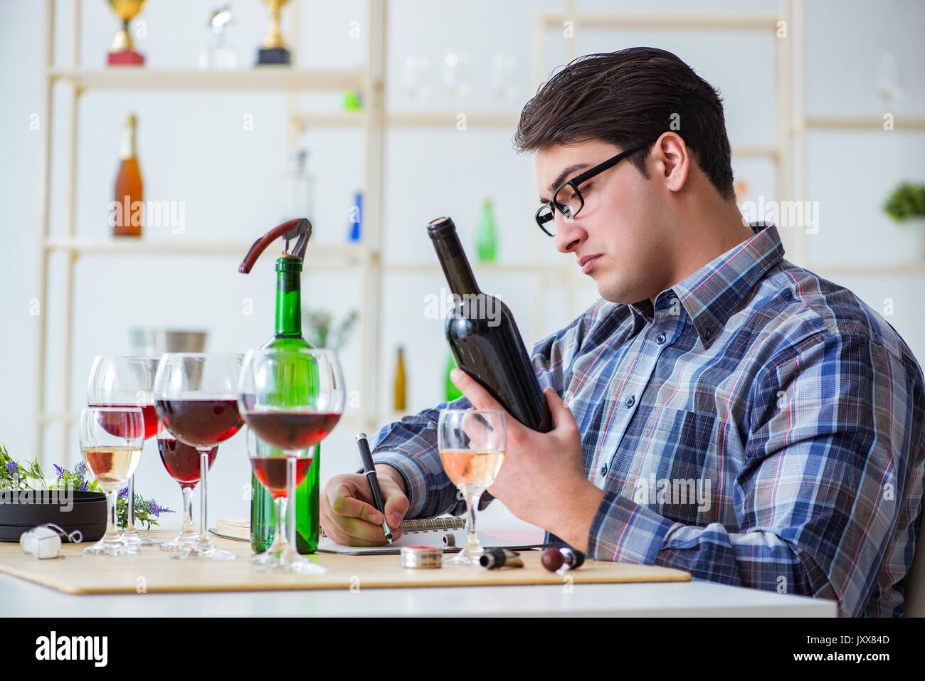 Professional sommelier tasting red wine Stock Photo - Alamy