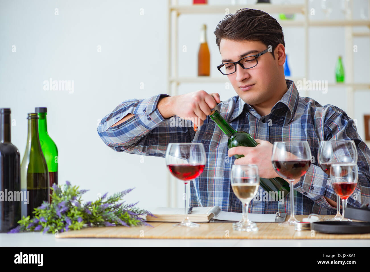 Professional sommelier tasting red wine Stock Photo - Alamy