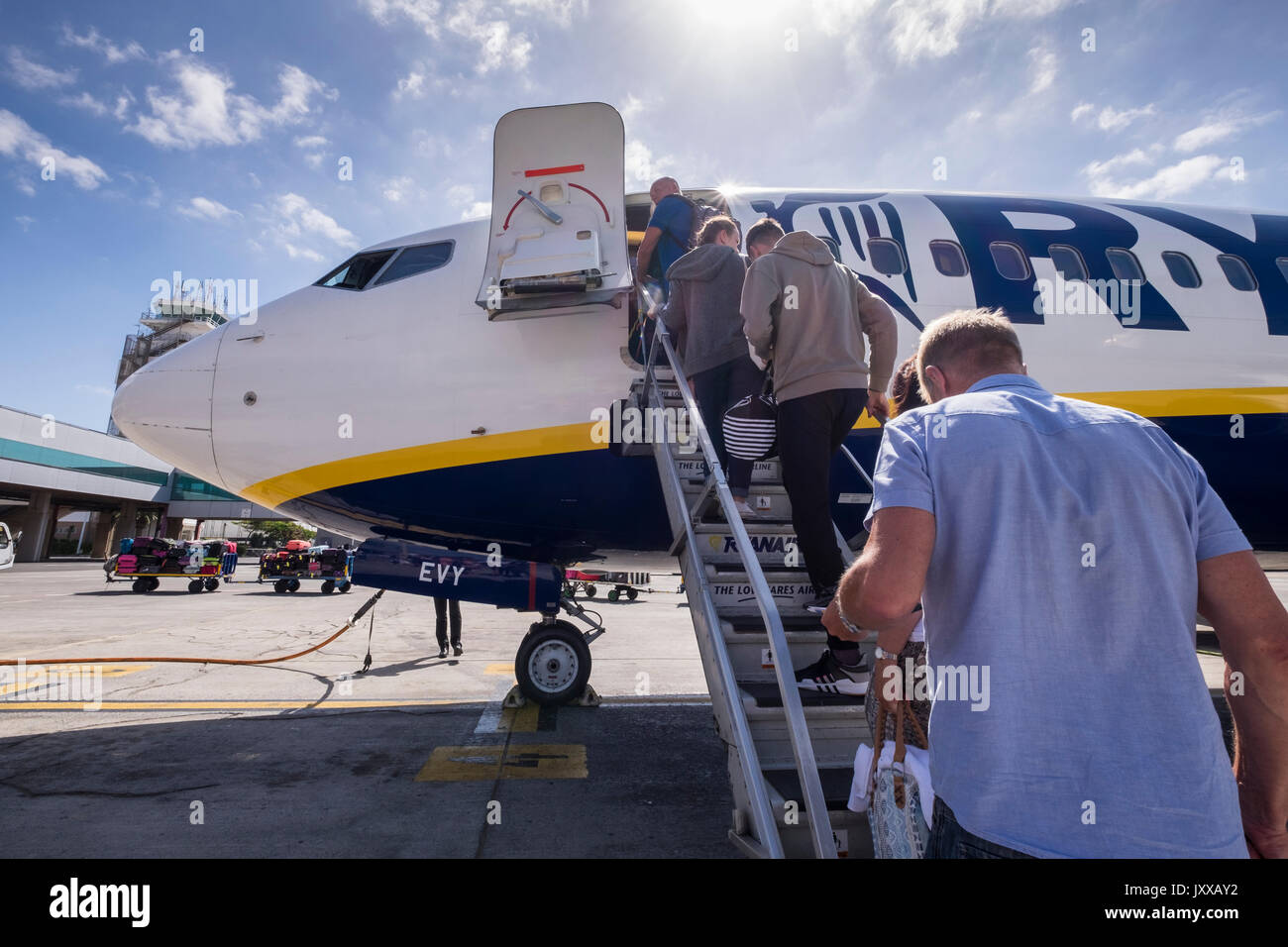 Passengers boarding a Ryanair flight via the front steps at Reina Sofia ...