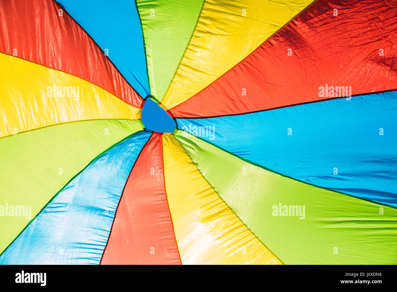 a parachute in many different bright colors Stock Photo - Alamy