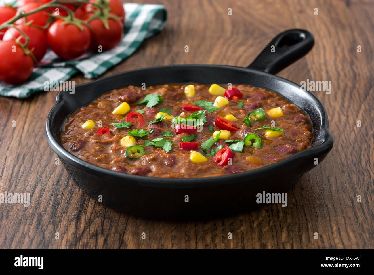 Traditional mexican tex mex chili con carne in a frying pan on wooden ...