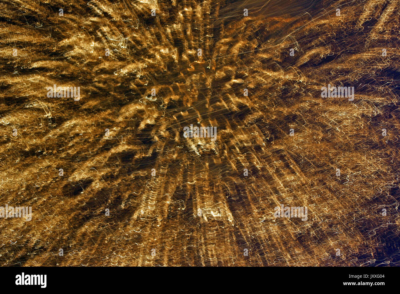 Firework exploding at slow shutter speed making an attractive pattern ...