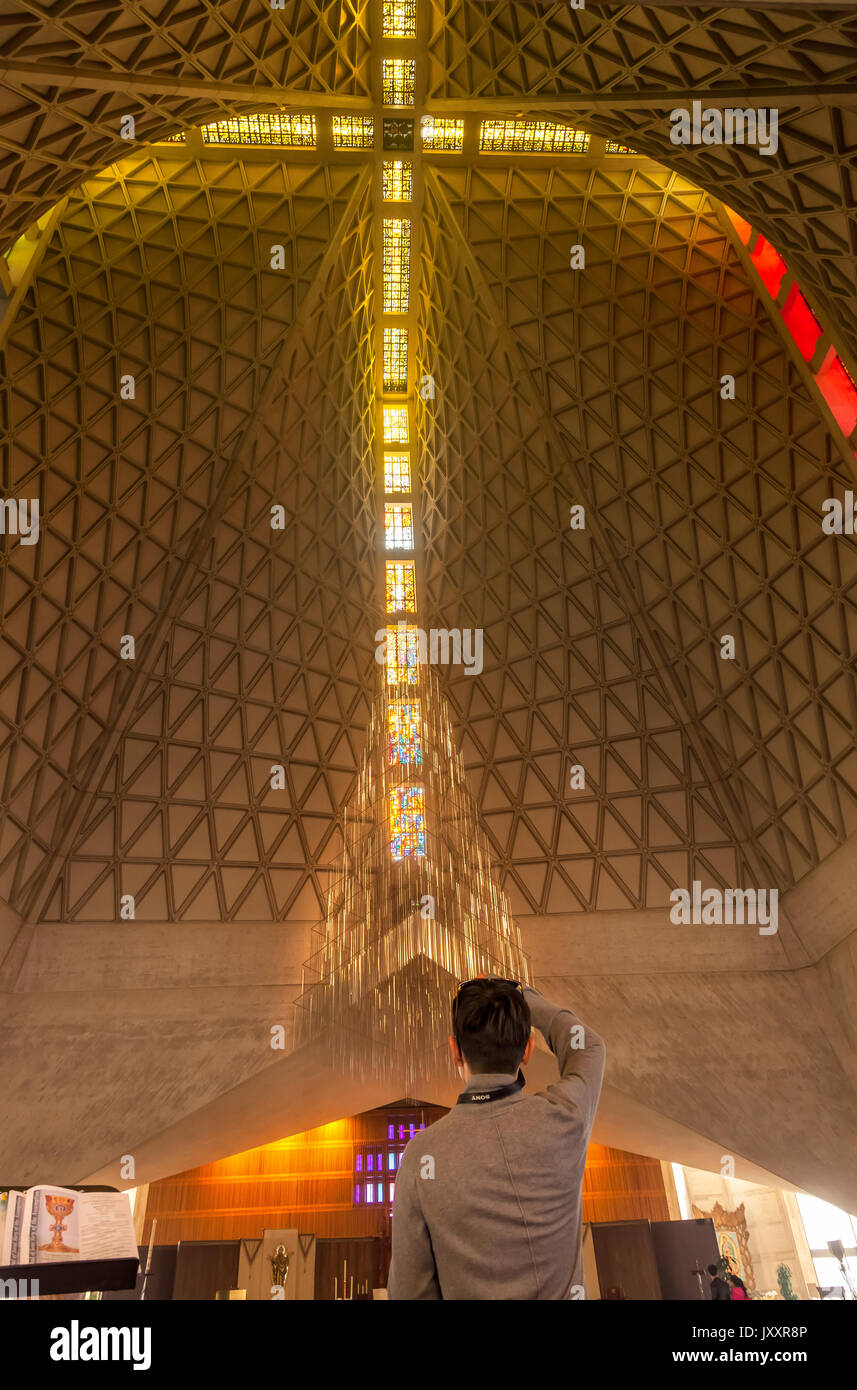 A churchgoer was taking pictures of the interior rooftop which formed a ...