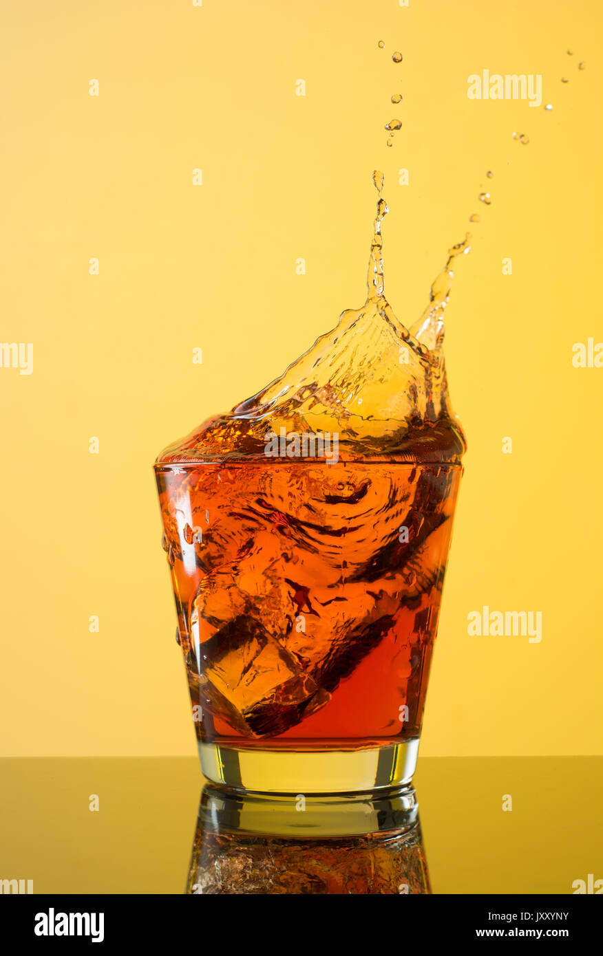 Whisky splashing out of glass hi-res stock photography and images - Alamy