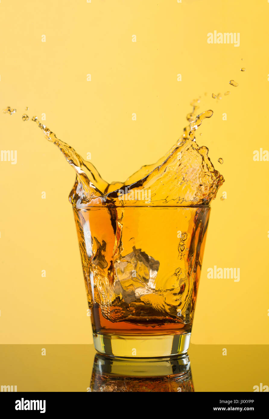 Whisky splashing out of glass hi-res stock photography and images - Alamy