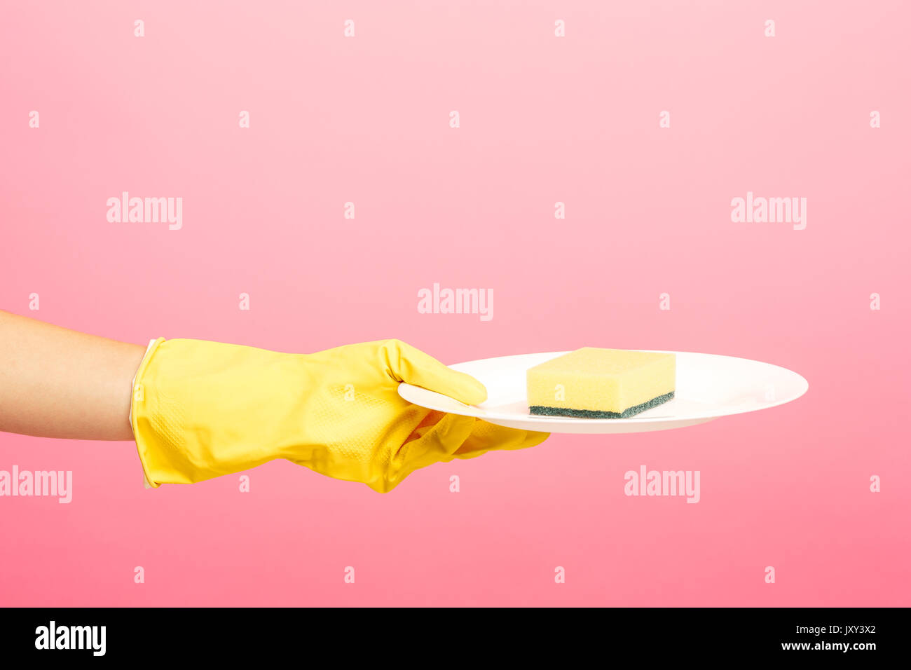 Hands in yellow protective gloves washing a plate Stock Photo - Alamy