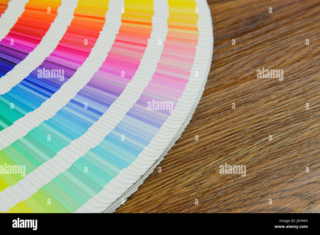 Beautiful color swatches book on wooden table Stock Photo - Alamy
