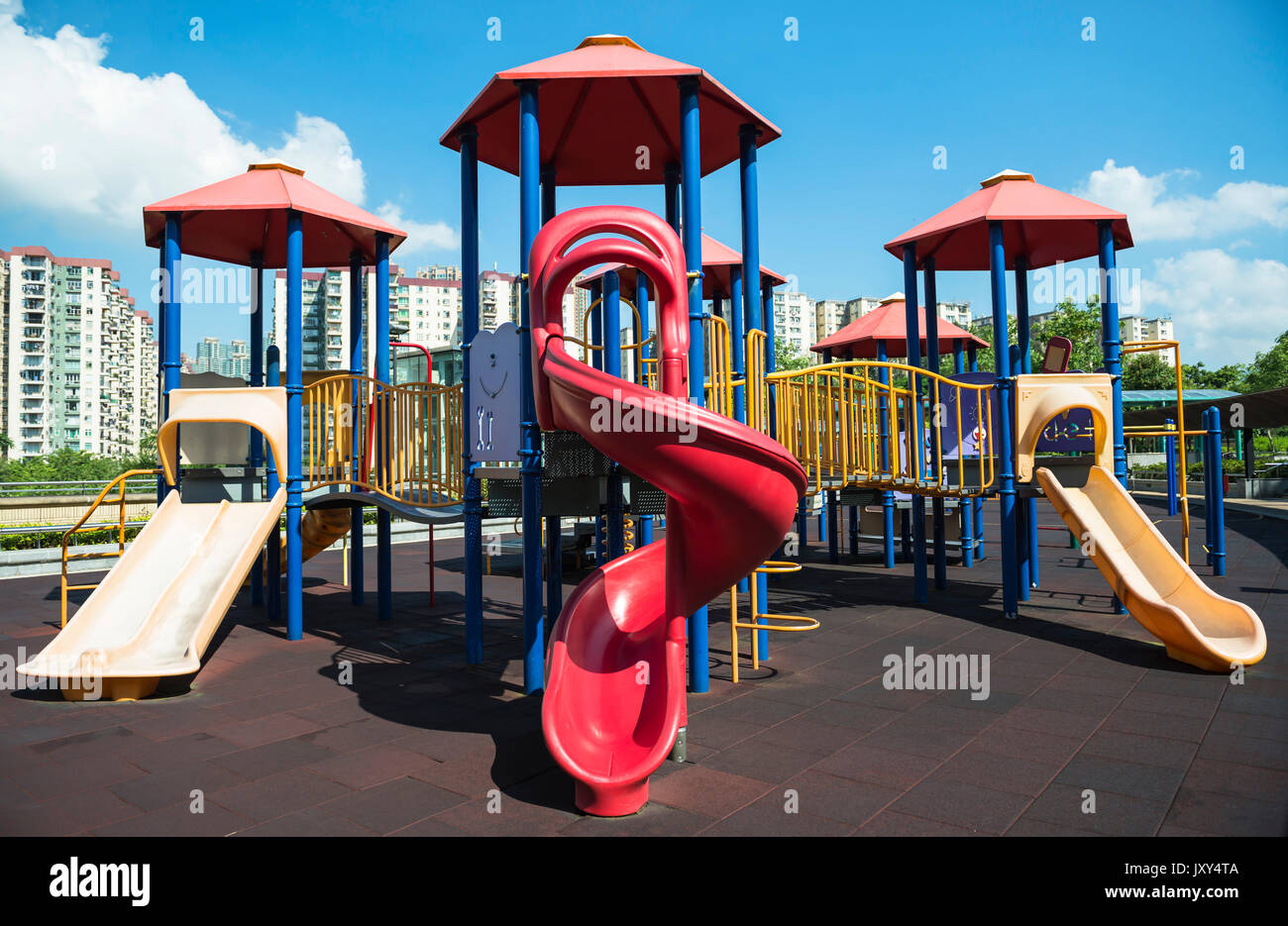 Playground with blue sky Stock Photo - Alamy