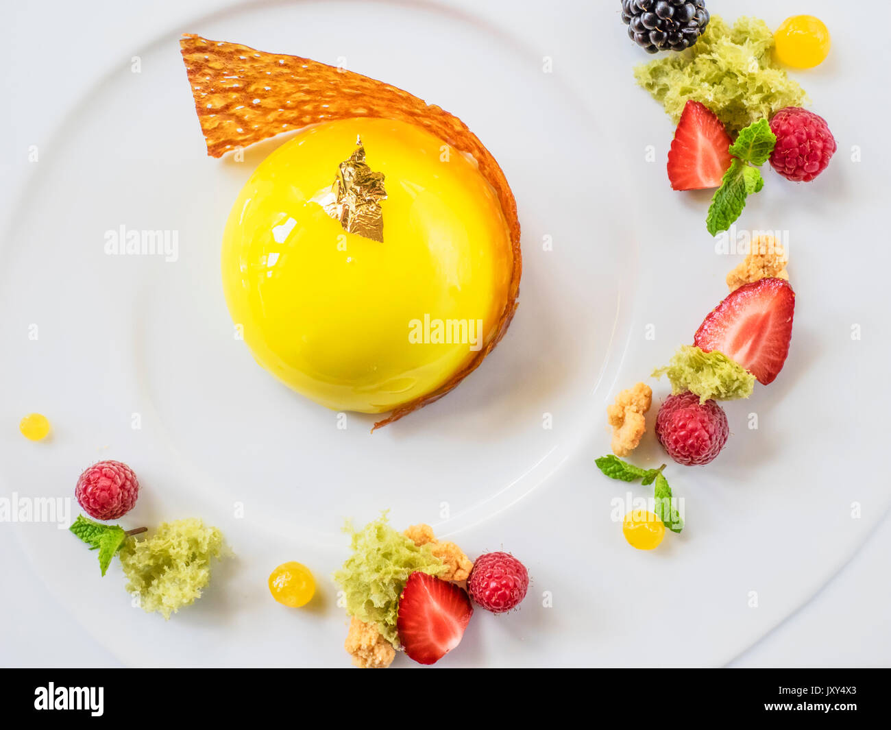 Mango parfait with passion fruit twill, and Apperol Shpritz Stock Photo ...