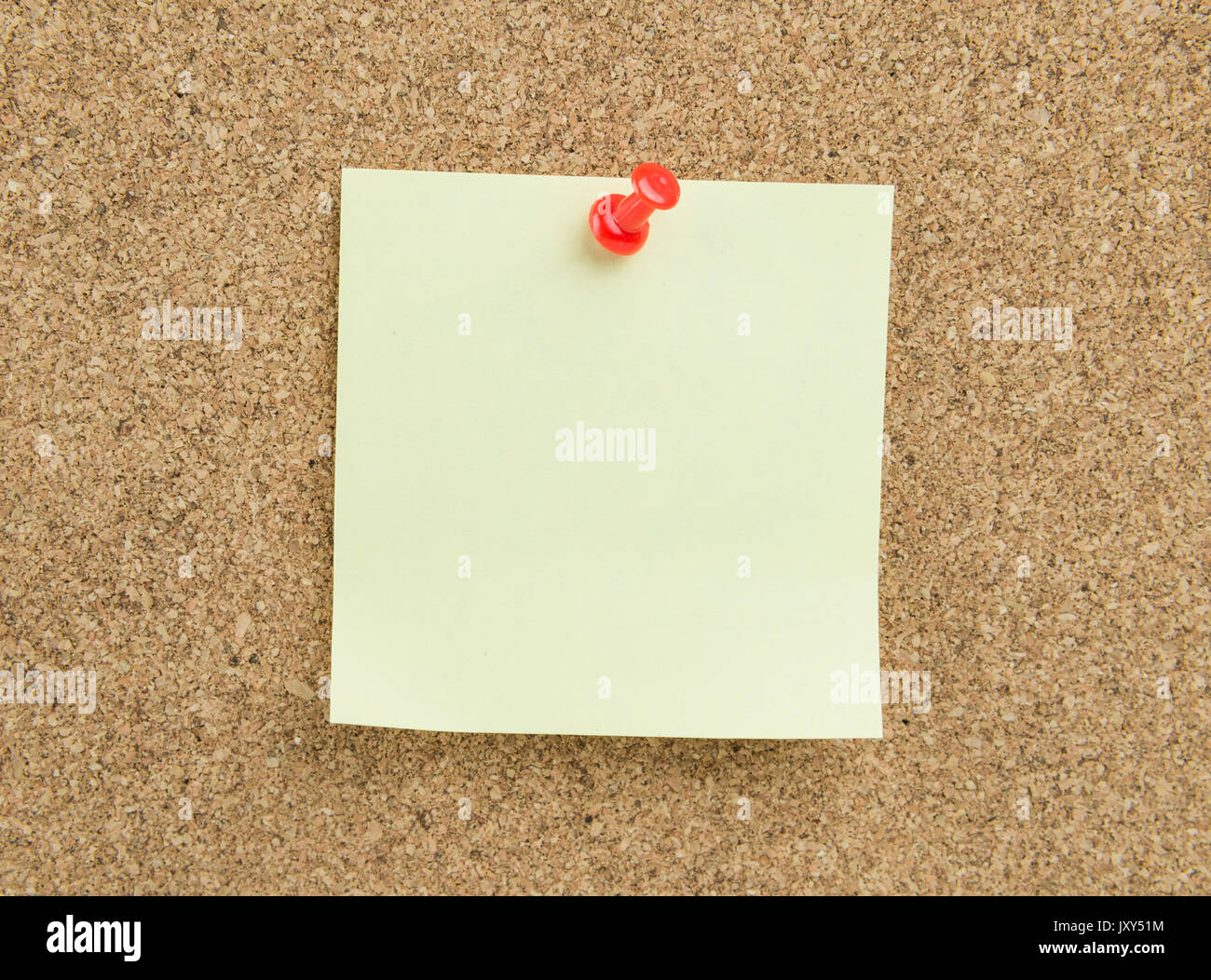 Sticky note on cork board background Stock Photo - Alamy