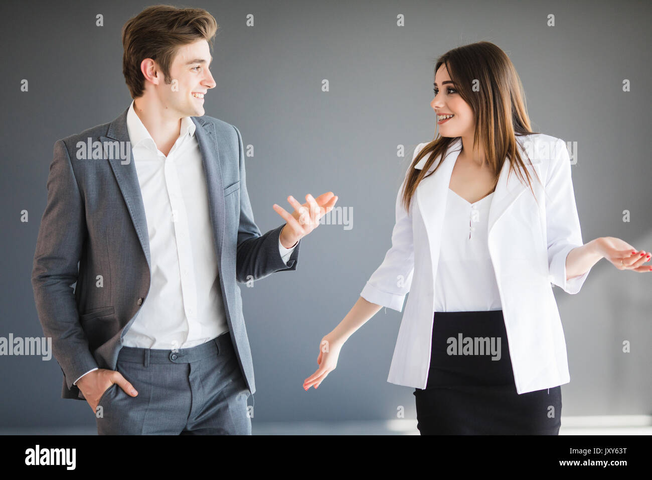 Woman shows something abstract to her business partner. Copy space ...