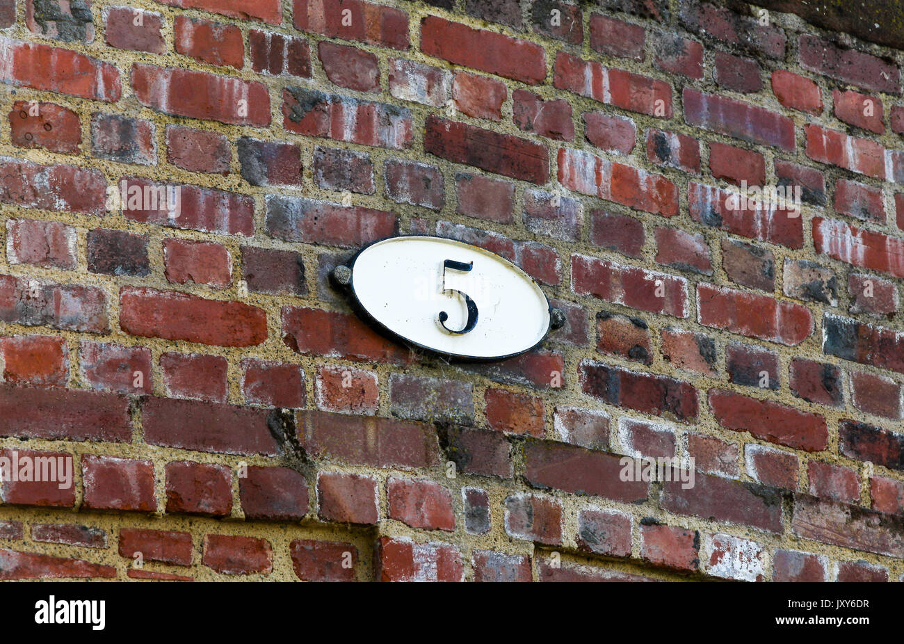A number plate on a canal bridge saying number 5 Stock Photo - Alamy