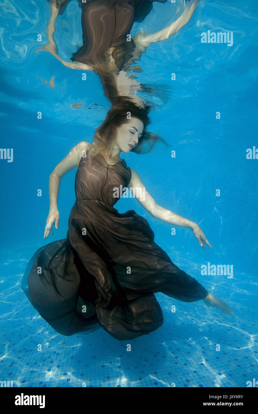 Beautiful female model posing pool hi-res stock photography and images ...