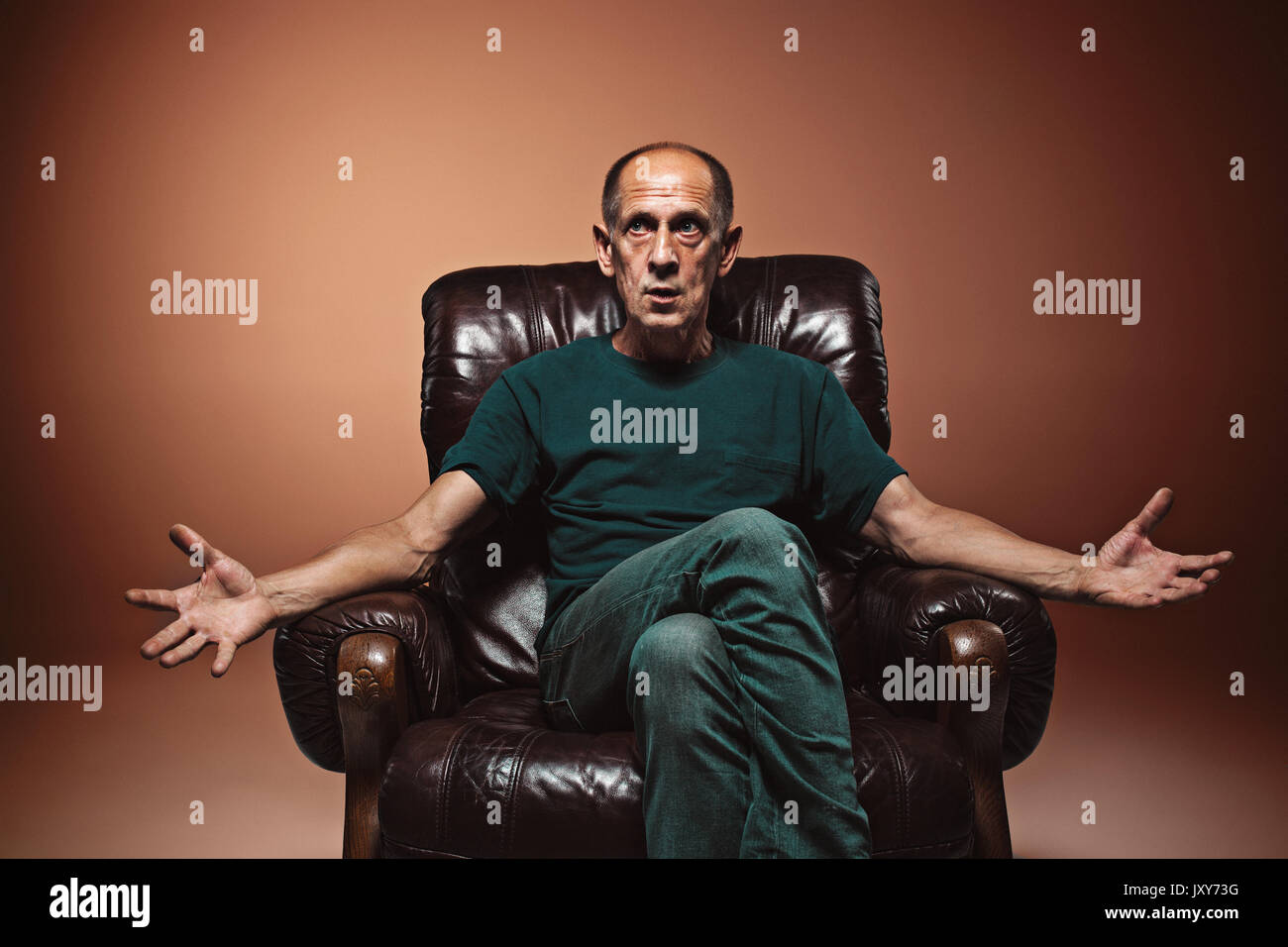 Worried serious old man sitting hi-res stock photography and images - Alamy