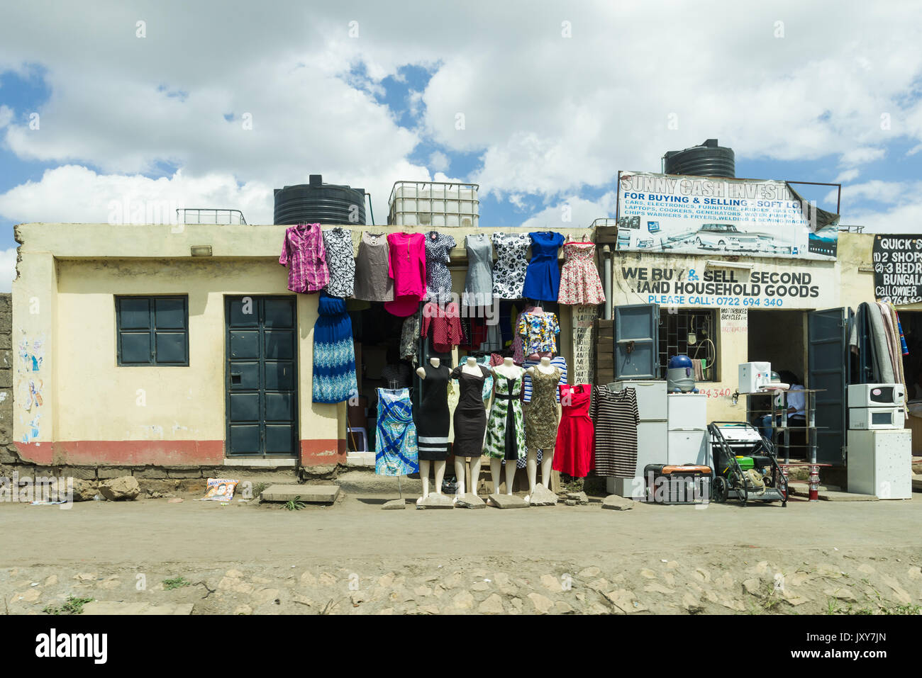Small shops by roadside selling clothes and electrical goods, Nairobi ...