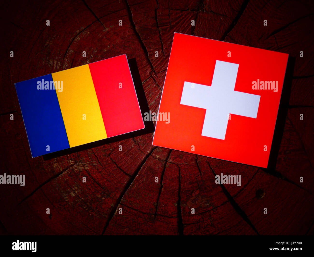 Chad flag with Swiss flag on a tree stump isolated Stock Photo - Alamy