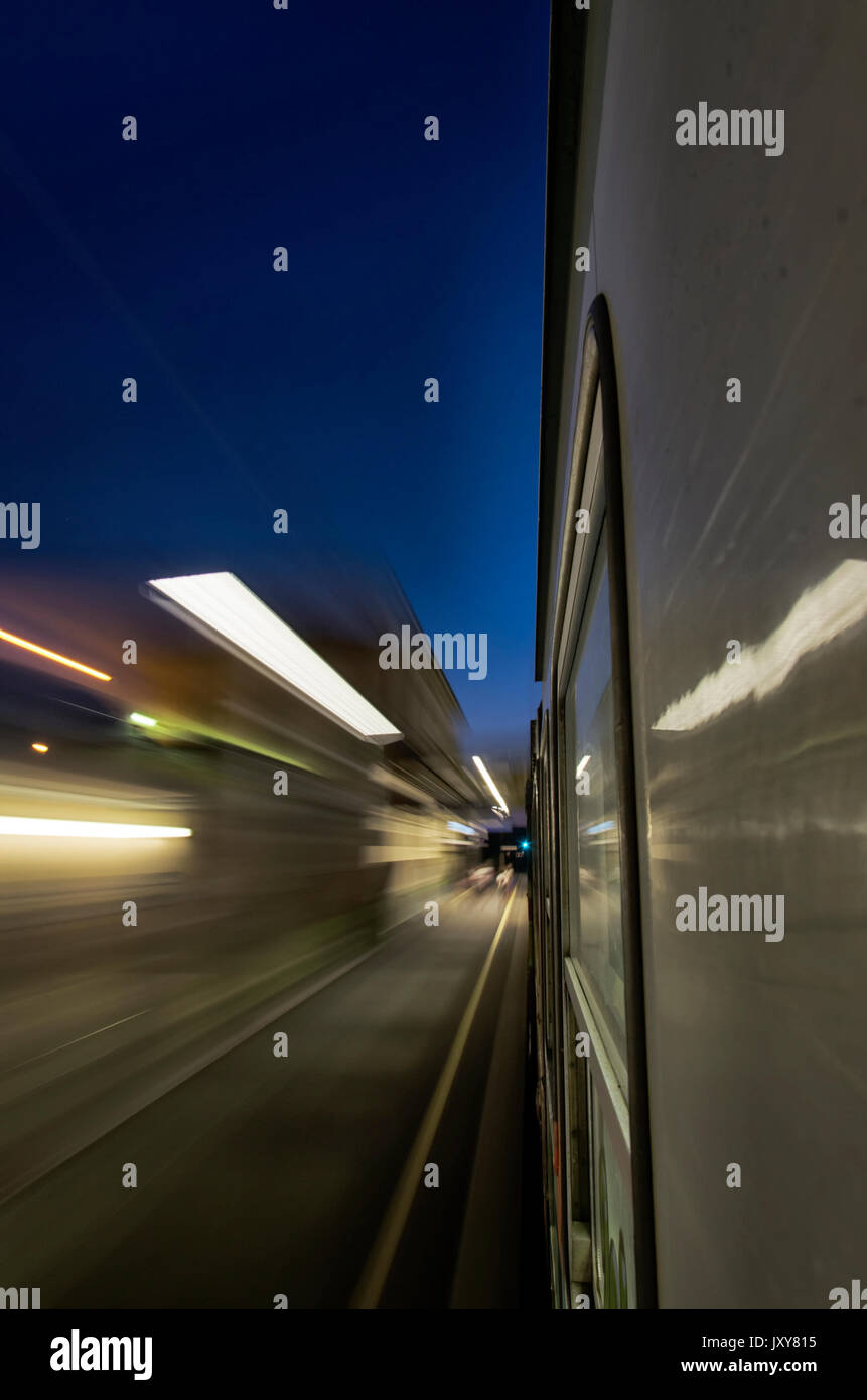 View of station lights from a train at full speed Stock Photo - Alamy