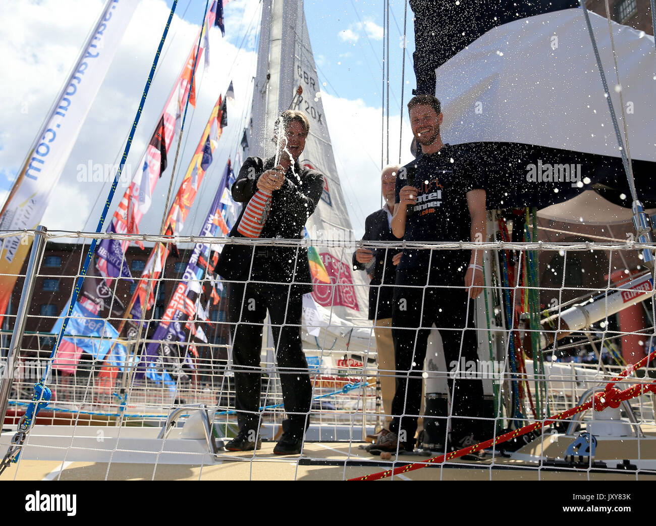 Tim Hentschel (left) CEO of HotelPlanner.com sprays champagne alongside ...