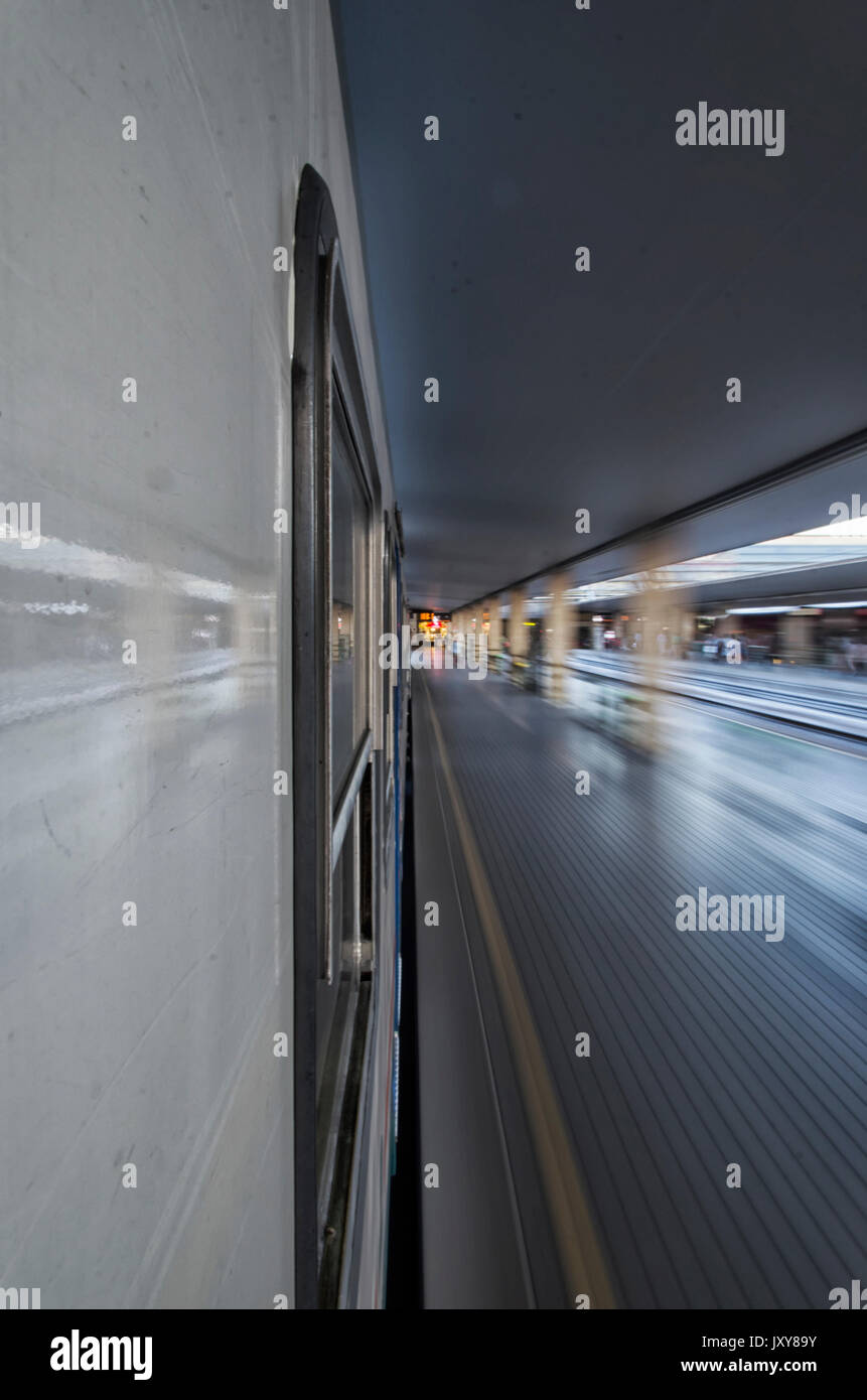 View of a train entering a station at moderate speed Stock Photo - Alamy