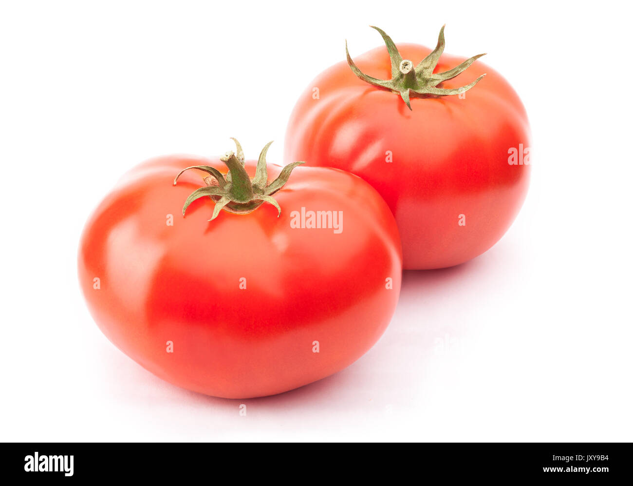 Two red tomatoes isolated Stock Photo - Alamy