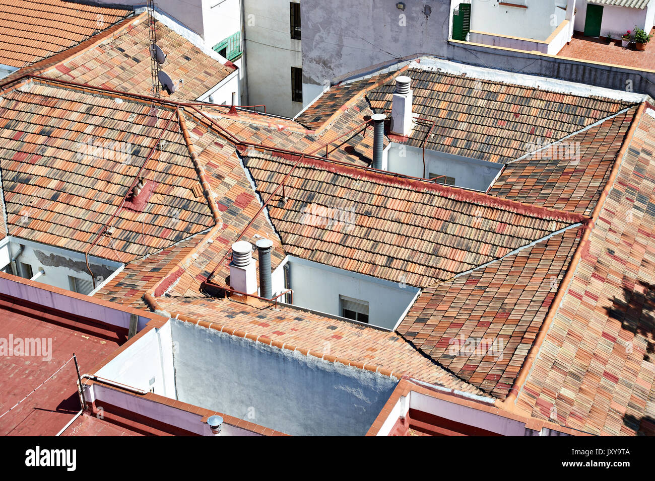 Old houses in a poor quarter with tiled roofs Stock Photo - Alamy