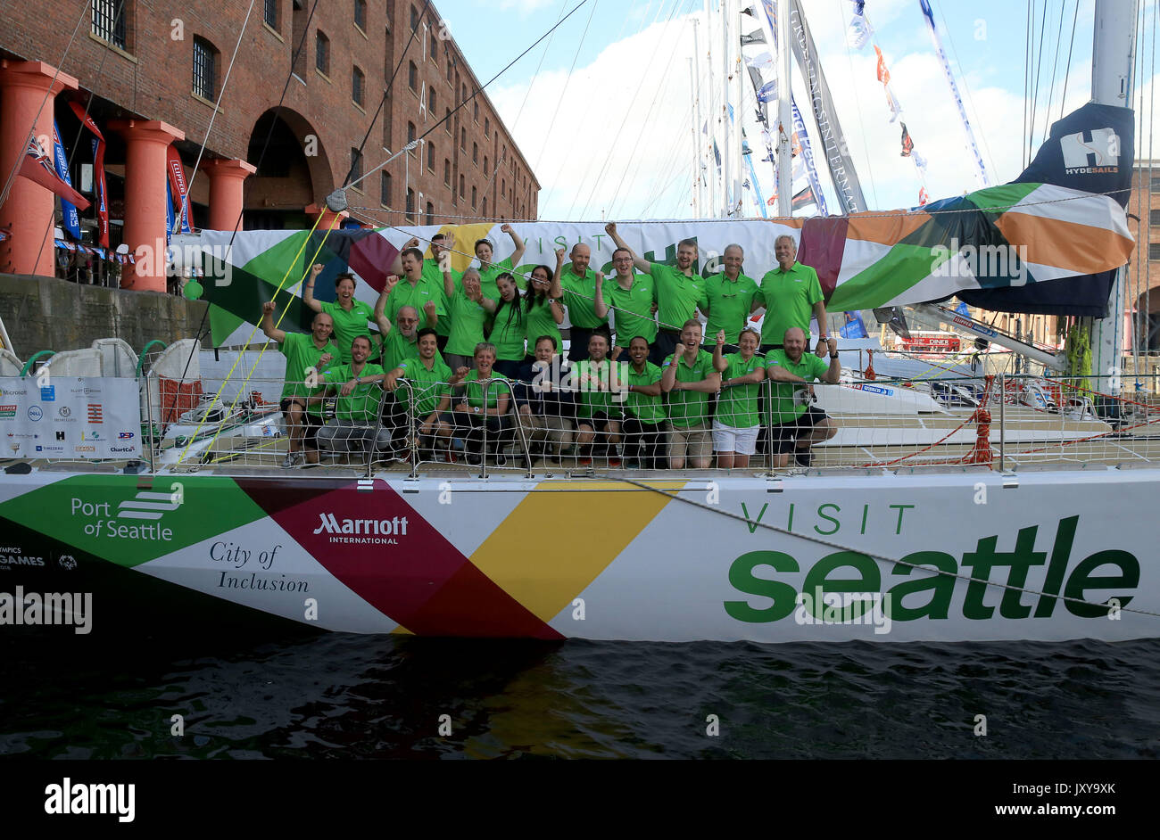 The crew of Visit Seattle pose for a photo at Albert Docks, Liverpool ...
