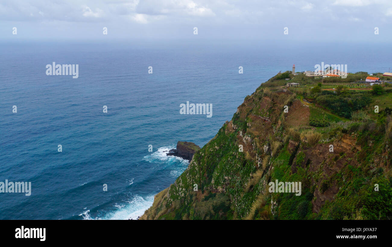 Madeira - Viewpoint at the coast with lighthouse and abrupt cliffs in ...