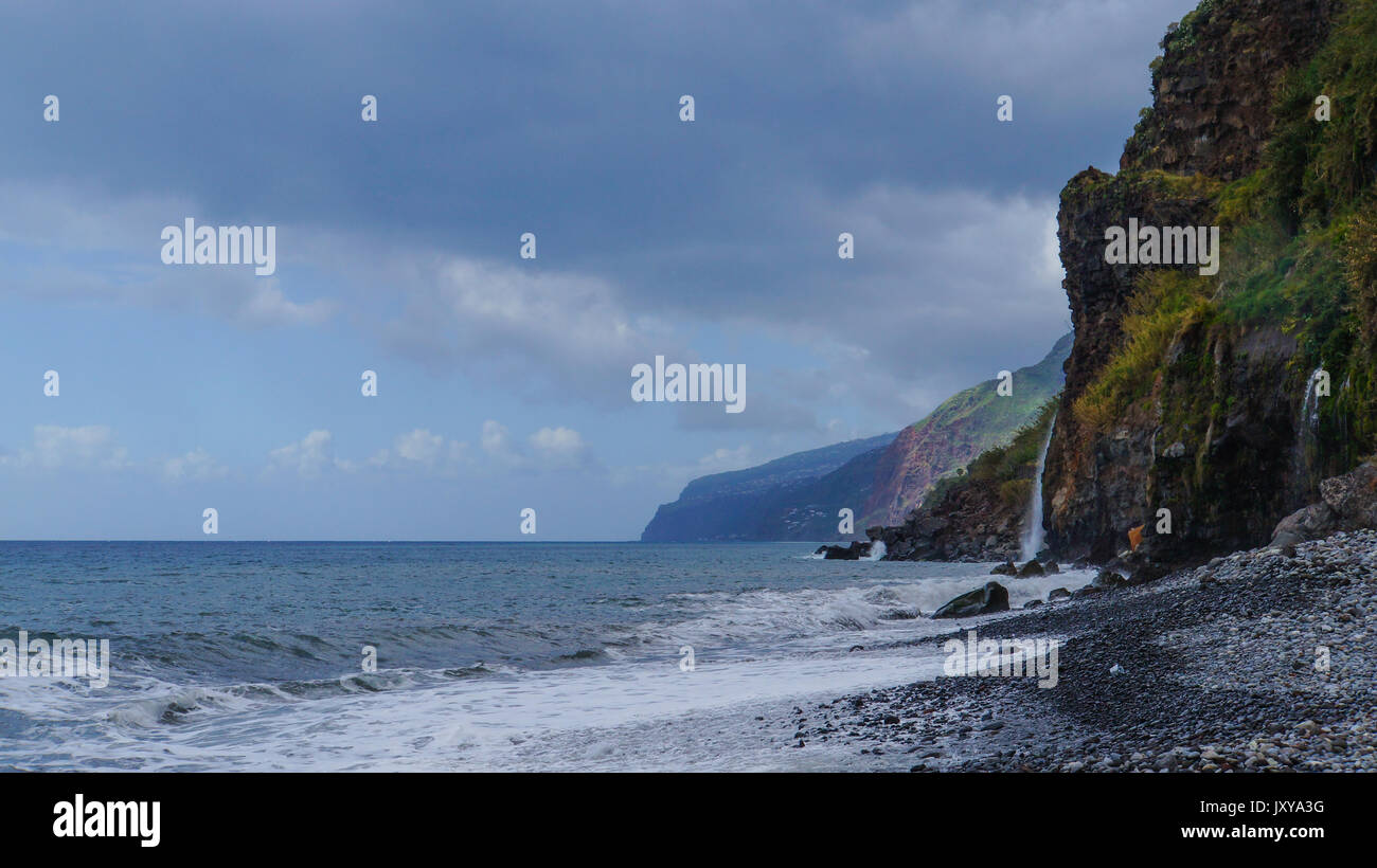 Madeira - Beach of City Ponta do Sol with waterfall to the ocean Stock ...