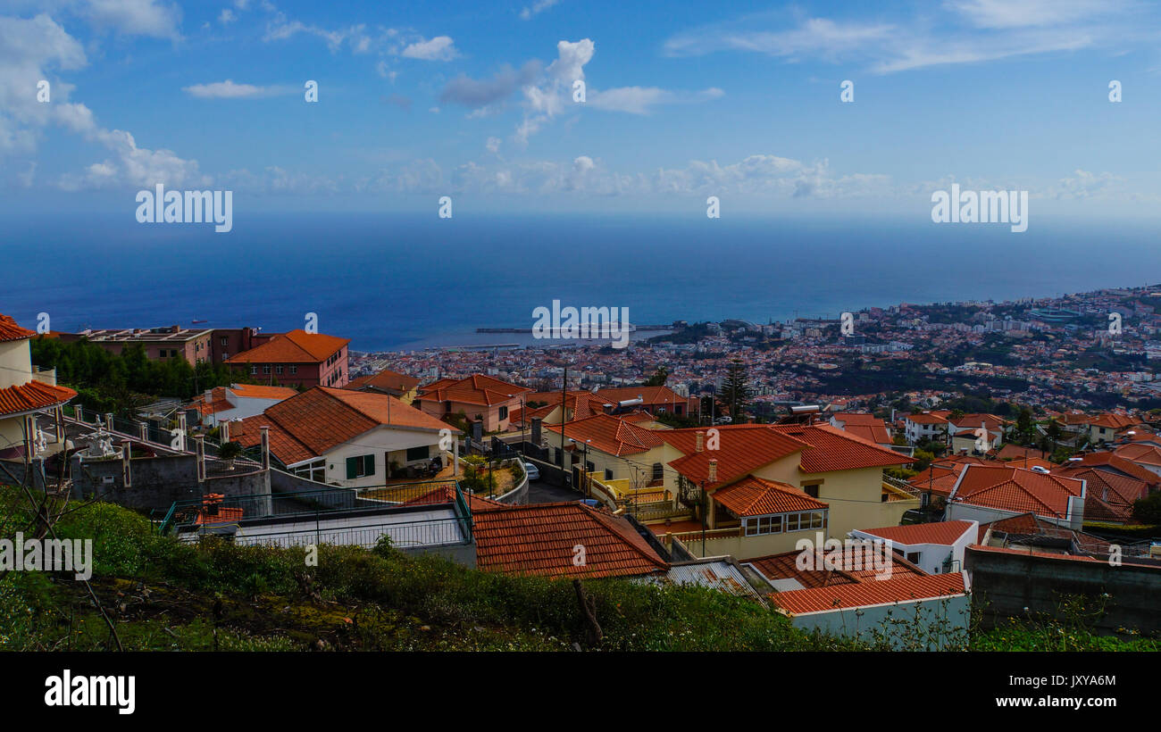 Madeira - View down to Funchal and the ocean from Monte with red roofs ...