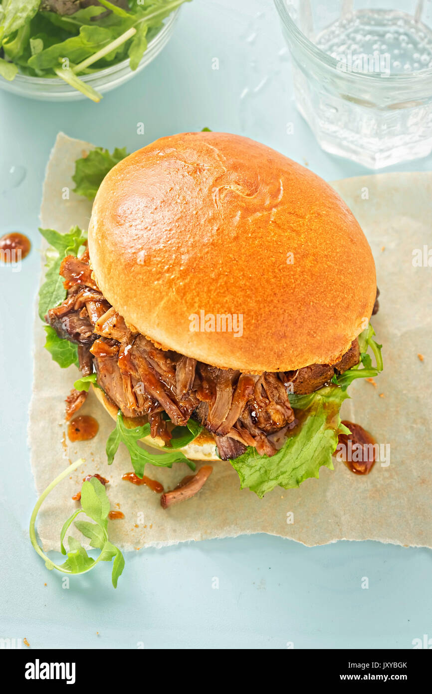 Pulled pork sweet bun with mixed lettuce leaves Stock Photo - Alamy