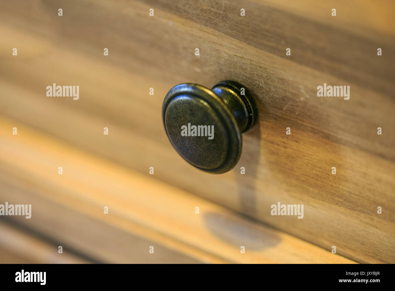 Steel drawer handle in a vintage furniture Stock Photo - Alamy