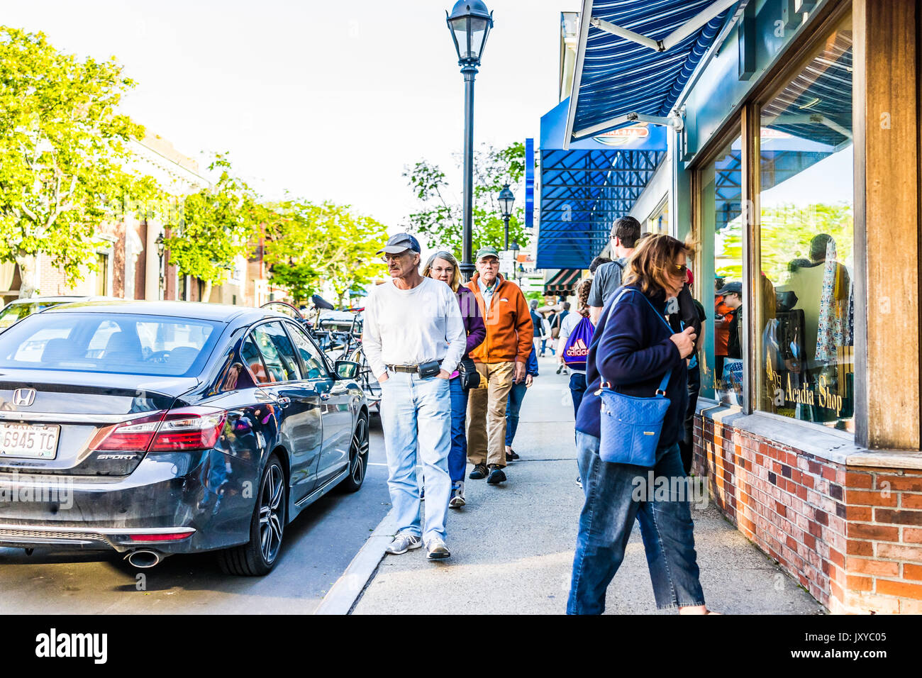 Bar Harbor, USA - June 8, 2017: Many people walking on sidewalk in ...